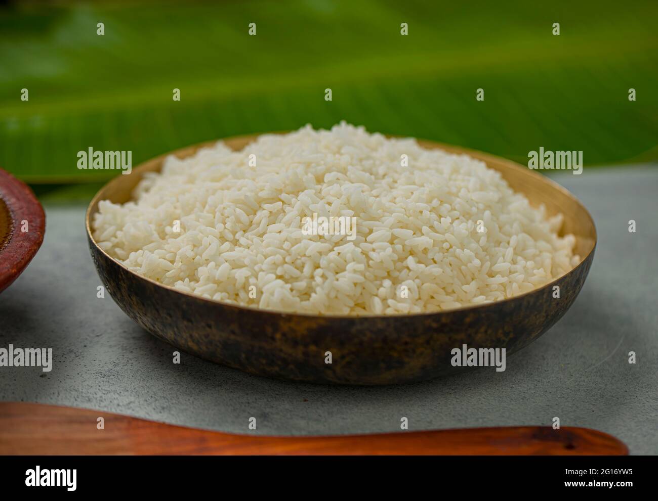 Cooked rice arranged in abrass vessel with Kerala traditional feast ...