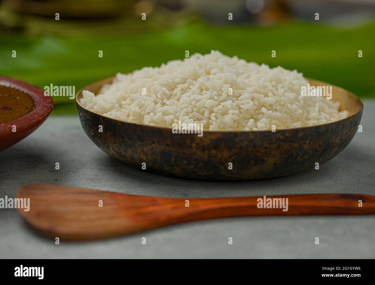 Cooked rice arranged in abrass vessel with Kerala traditional feast ...