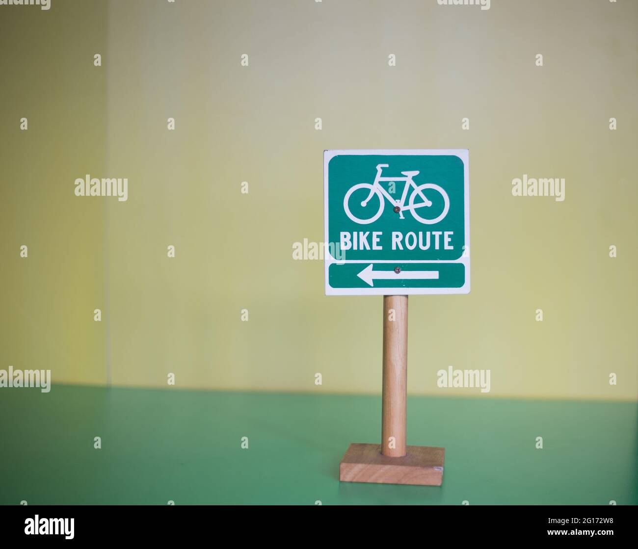 Closeup shot of a blue "Bike route" sign with an arrow showing the ...