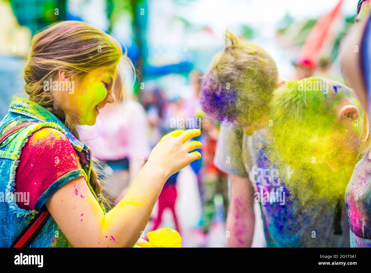 People sprinkle colorful paints during celebrating holi fest Stock ...