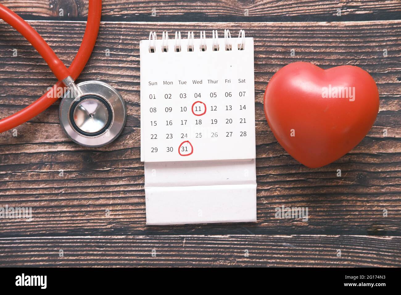 stethoscope, calendar and heart shape symbol on table Stock Photo - Alamy