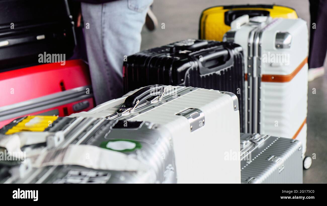 Pile of bag suitcases at airport terminal Stock Photo - Alamy