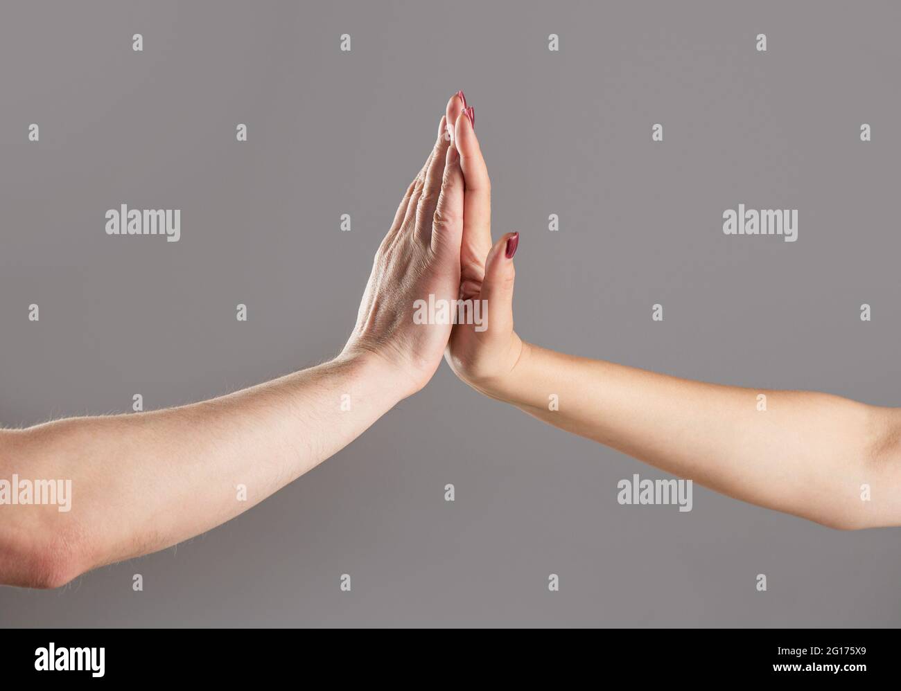 Man and girl giving high five. Two hands, male and female. High-five ...