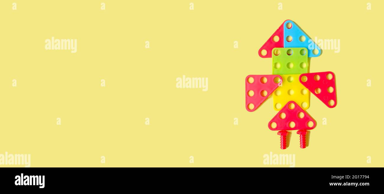 Rocket from a children's constructor on a yellow background Stock Photo ...