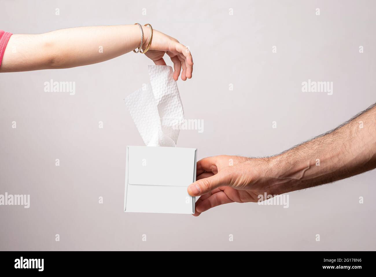 Little girl hand pulling a tissue from tissue box, editable mock-up ...