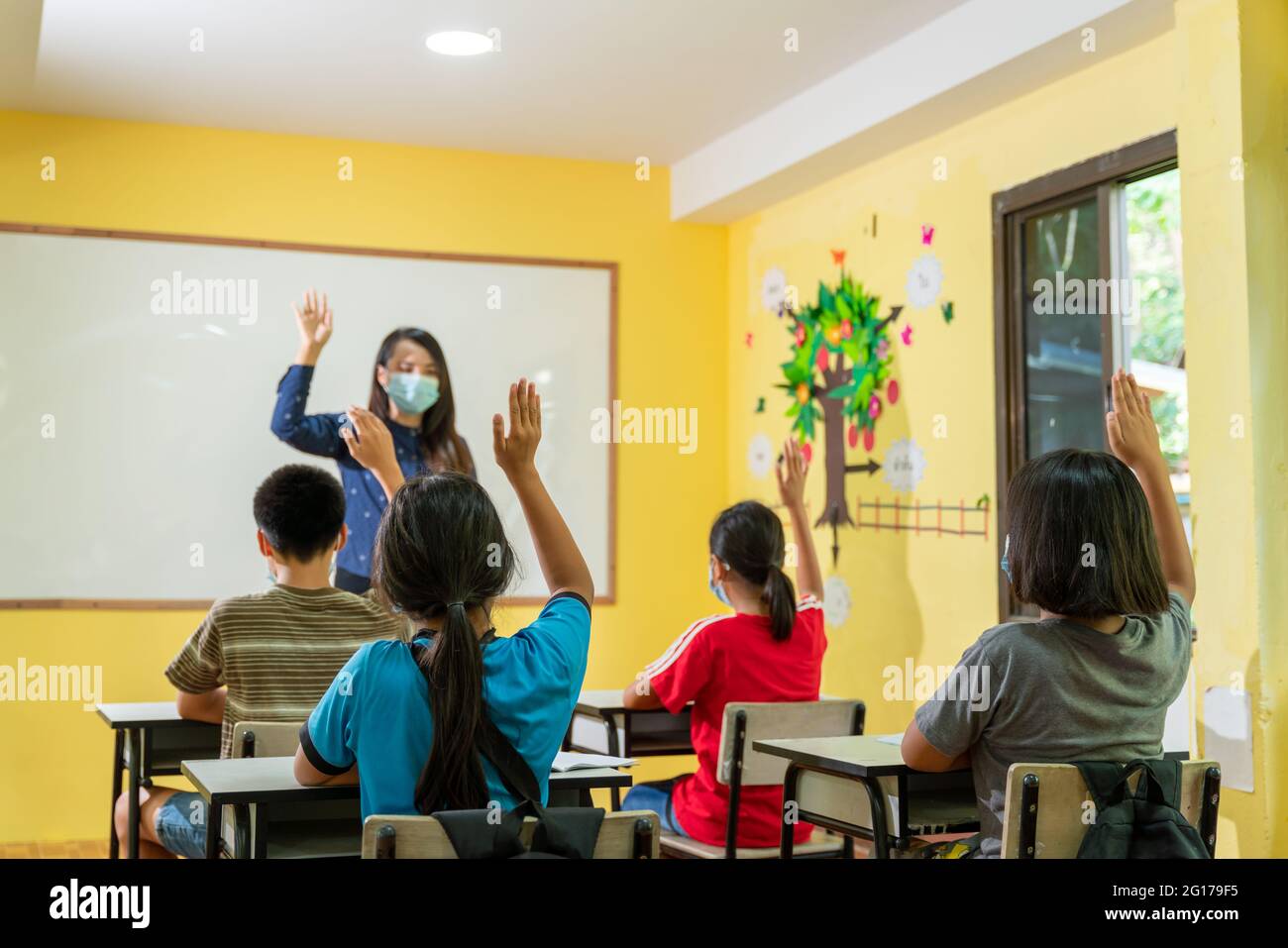 Teacher welcoming kids to school hi-res stock photography and images ...