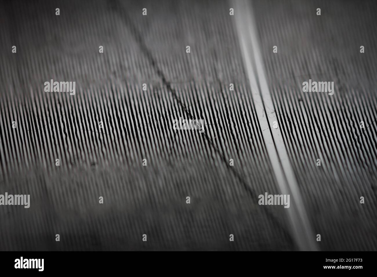 Macro shot of black vinyl record showing scratches. Surface of an old ...
