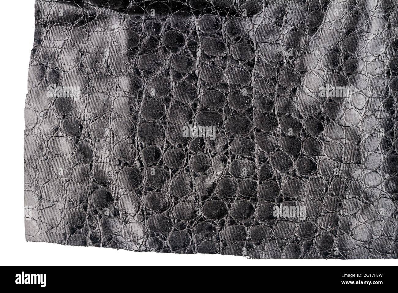 Piece of black artificial leather isolated on white background. Fake ...