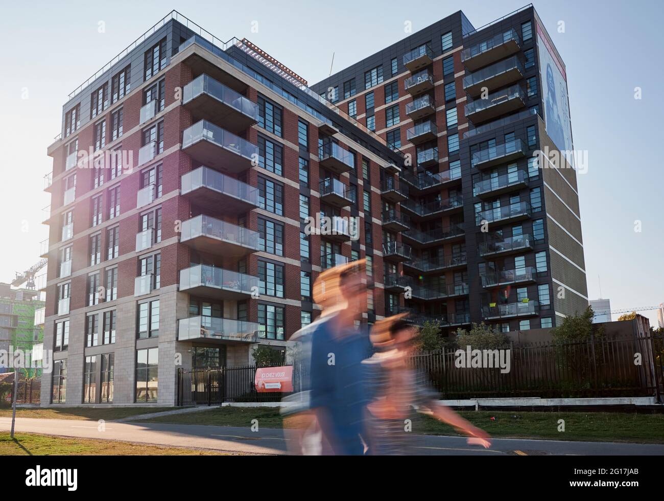 People walking infront of condo building in urban area, Montreal ...
