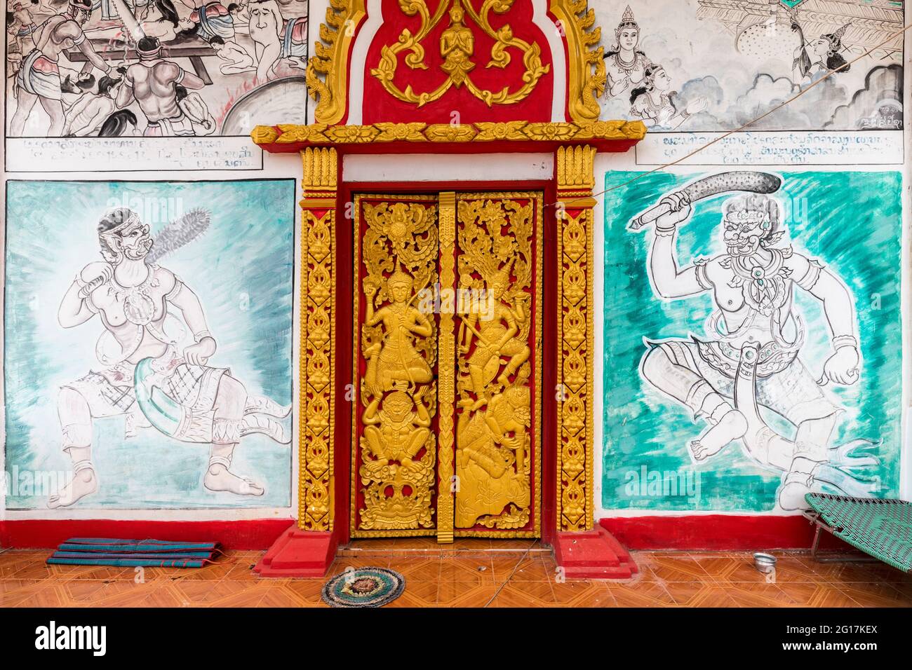 Temple door with side panel illustrations, Champasak, Laos Stock Photo ...