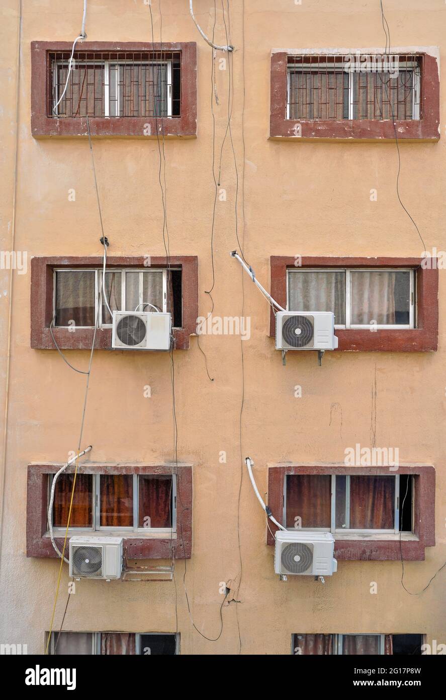 Air conditioning external units with large fans on old building facade ...