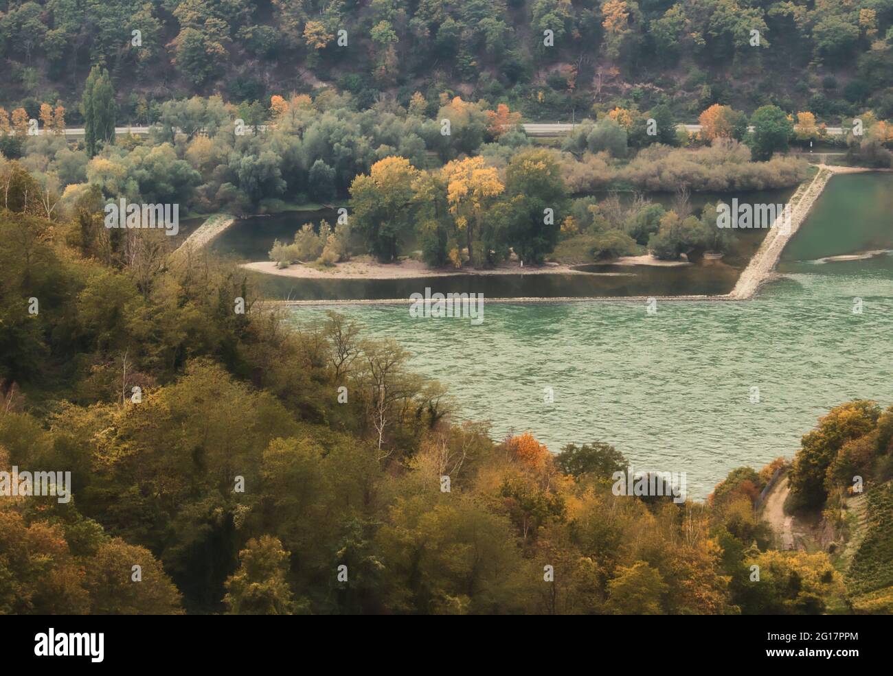 Island in the Rhein river surrounded by colorful trees on a fall day in ...