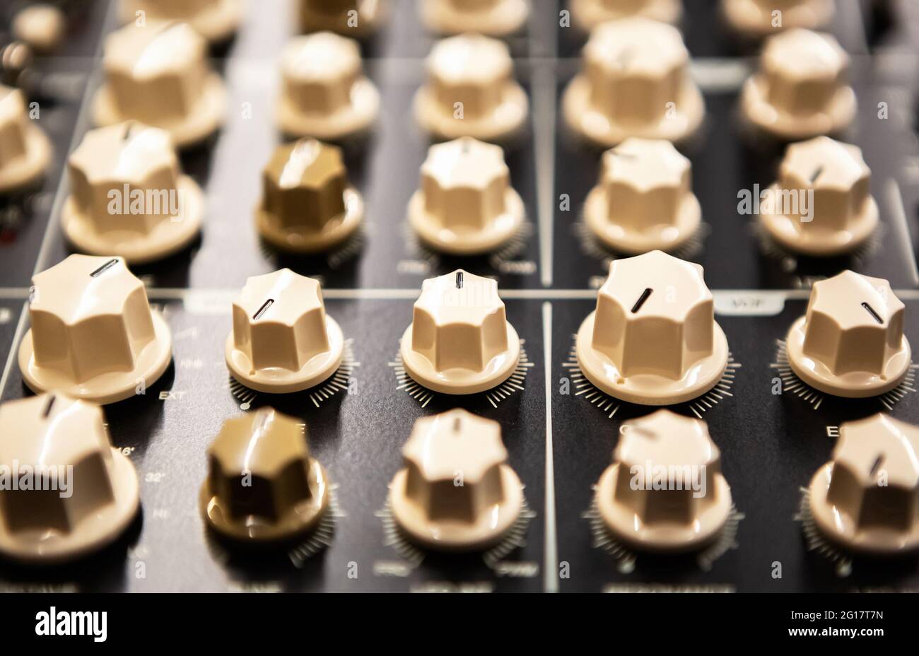 Analog equalizer panel on sound mixer. Mix musical tracks and record ...