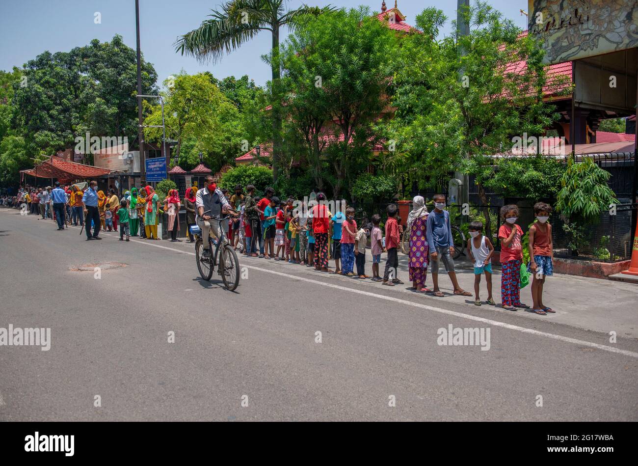 New Delhi, India. 05th June, 2021. Indian children wait in a queue for ...