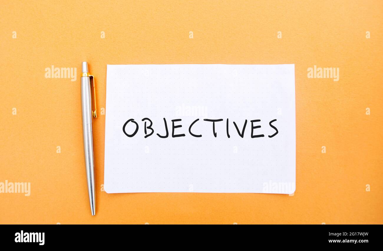 Note with the word Objectives. Planning, plans and tasks. New business ...