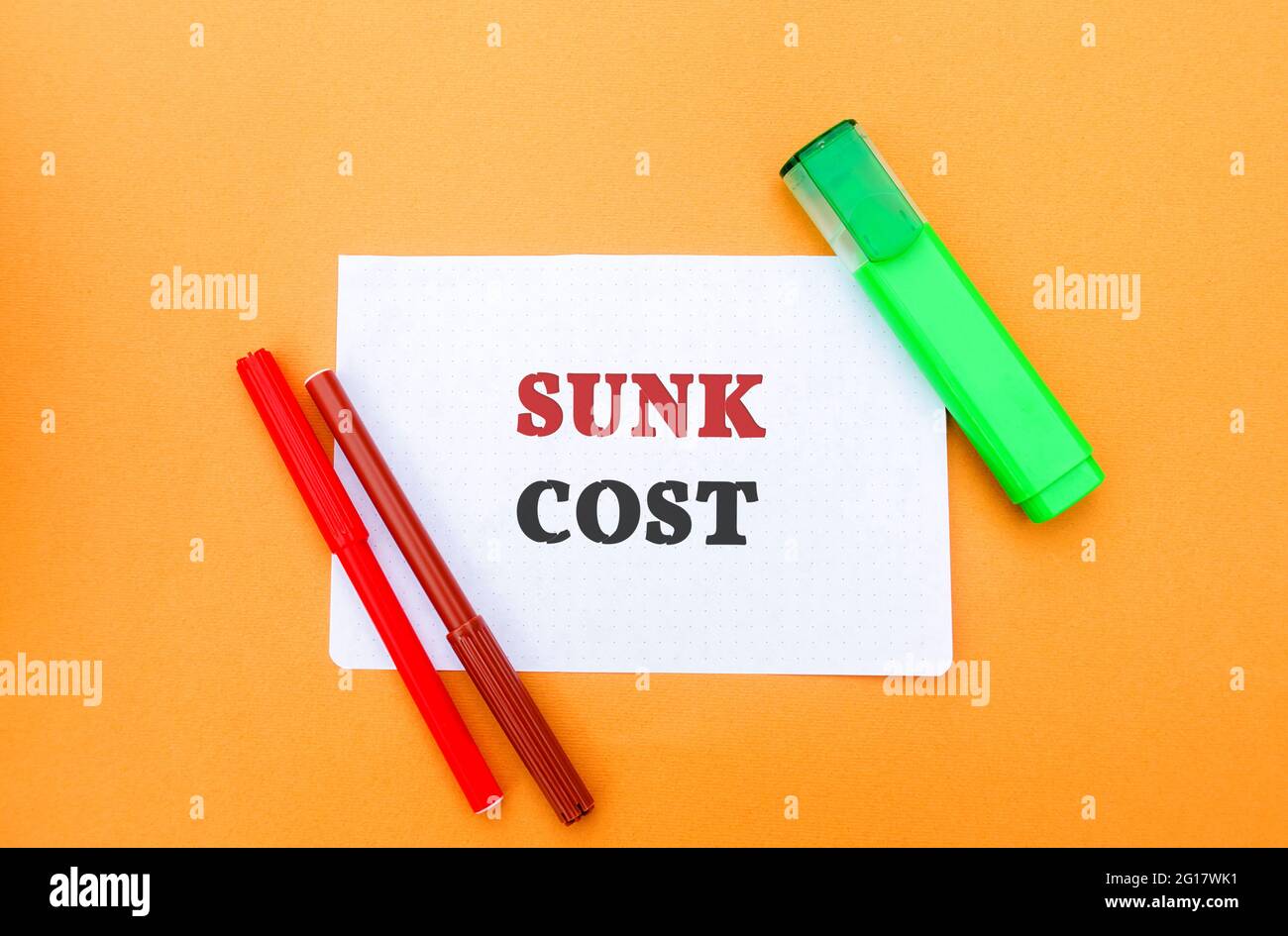 Note with words Sunk cost - retrospective cost and markers. Costs that ...