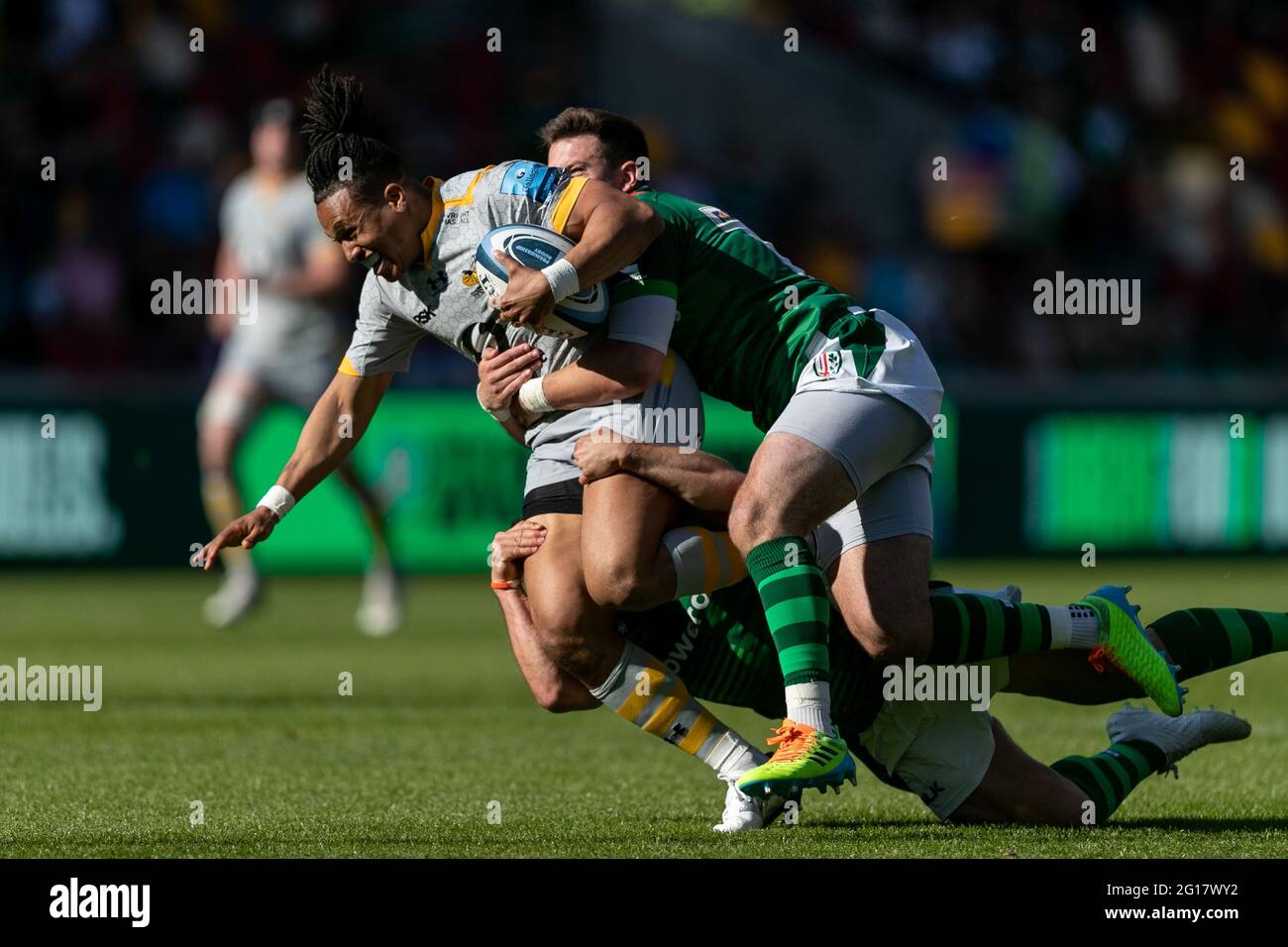 LONDON, UK. JUNE 5TH: Marcus Watson of Wasps is tackled by Tom Parton ...