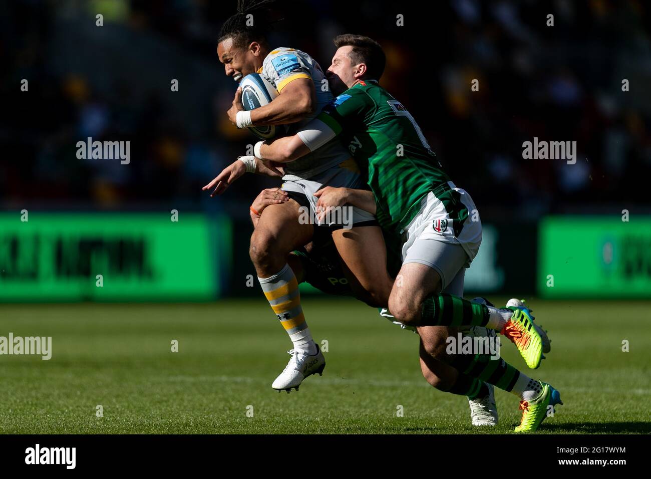 LONDON, UK. JUNE 5TH: Marcus Watson of Wasps is tackled by Tom Parton ...
