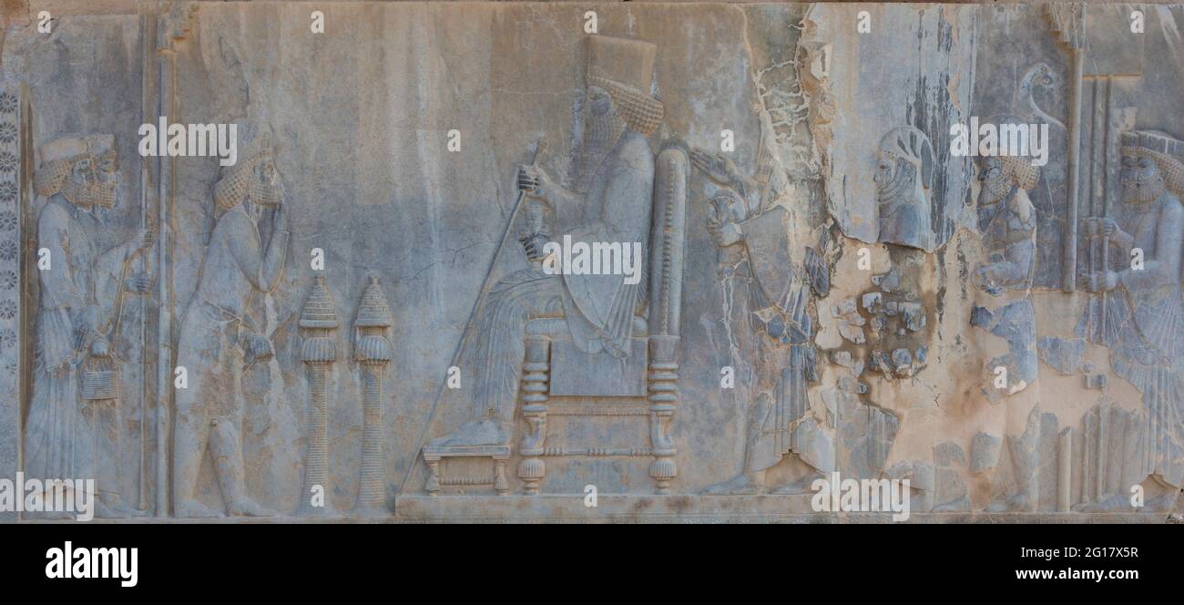 Bas-relief of King Darius sitting on his throne receiving visitors ...