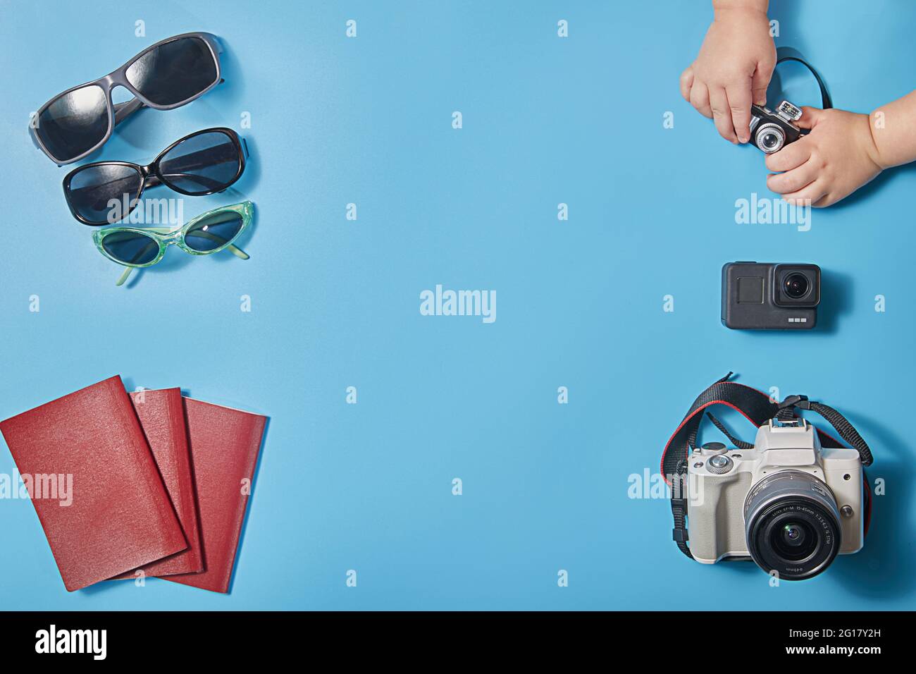 Creative concept of a flat trip with cameras, sunglasses and passports ...