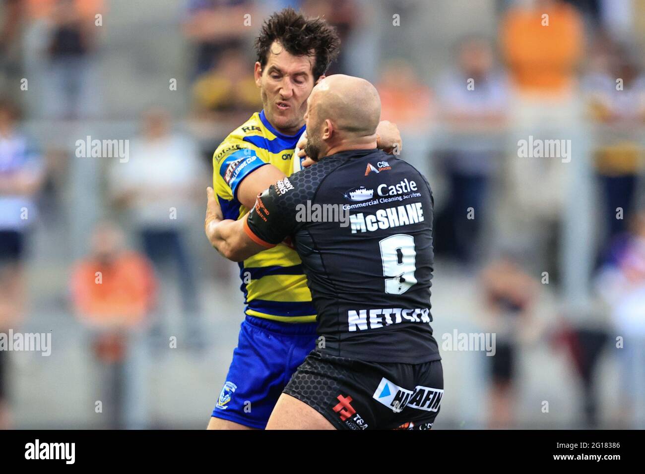 Stefan Ratchford (1) of Warrington Wolves in the tackle of Paul McShane ...