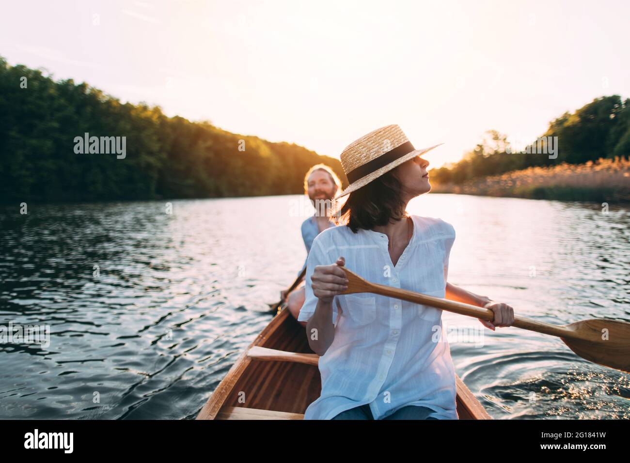 Woman paddling canoe hi-res stock photography and images - Alamy