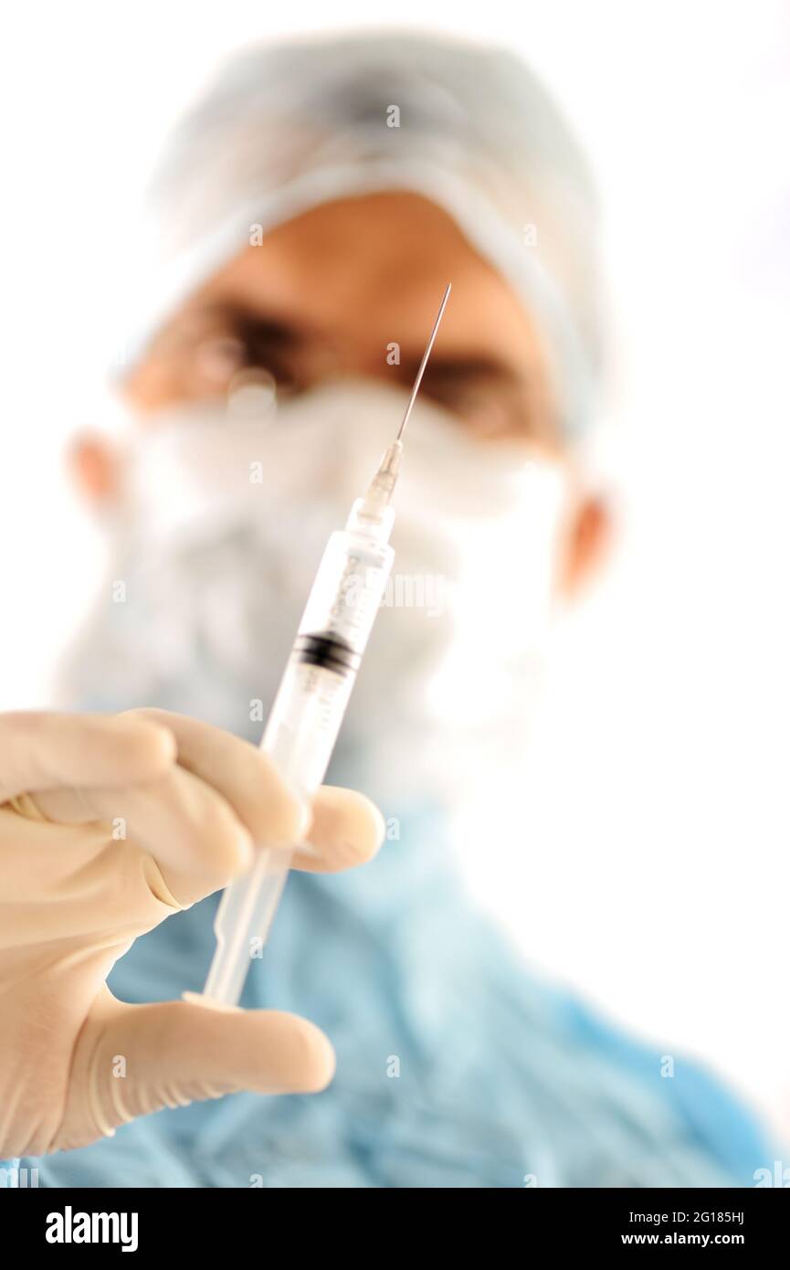 Doctor holding injection Stock Photo - Alamy