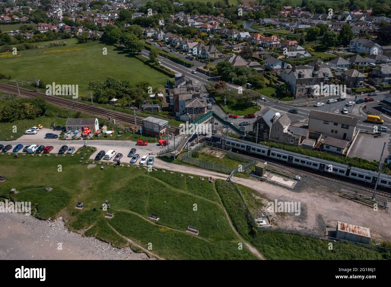 Aerial Photo of Hest Bank Level Crossing in Morecambe as a train passes ...