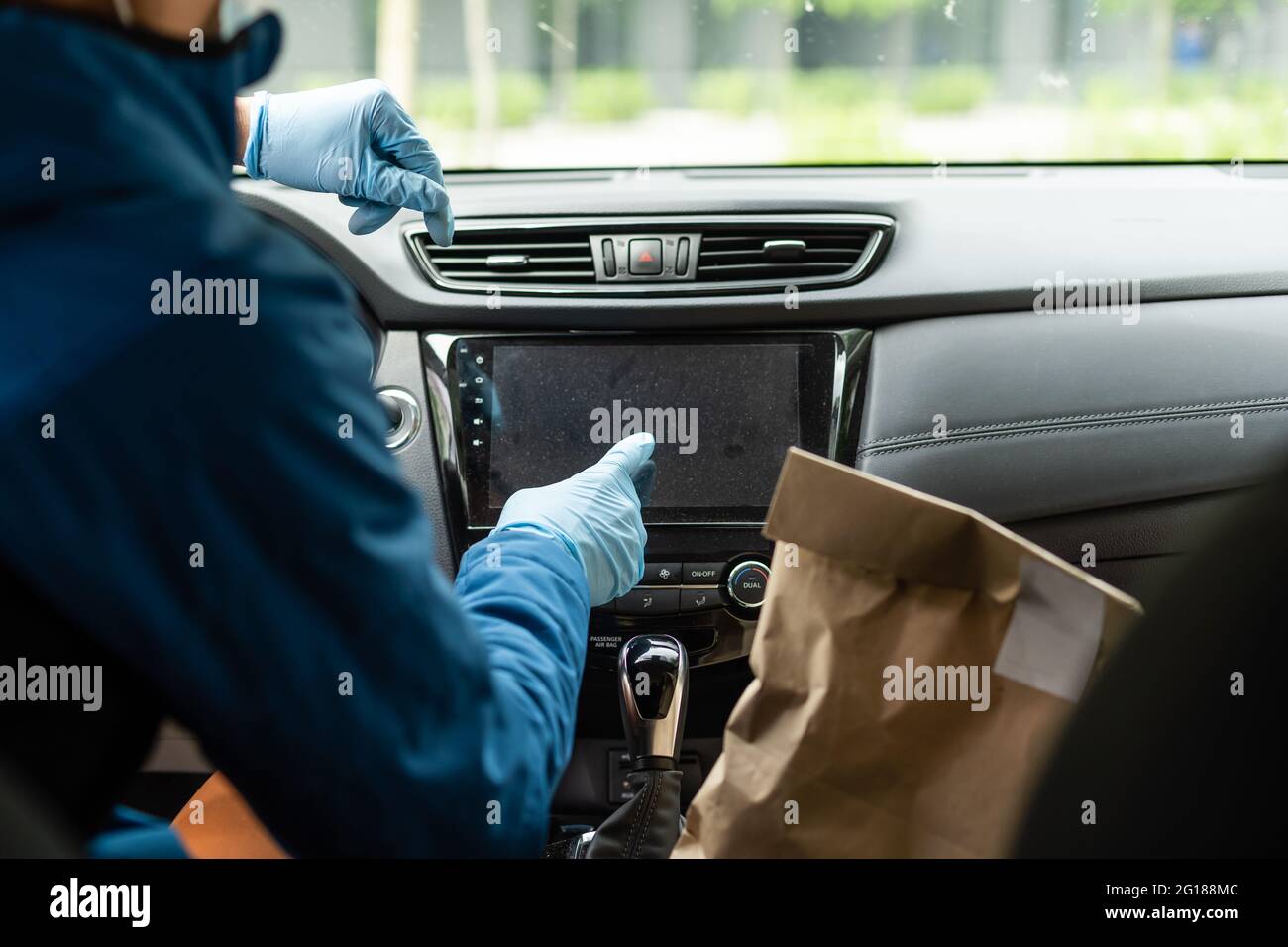 parcels in delivery car. driving with parcels Stock Photo - Alamy