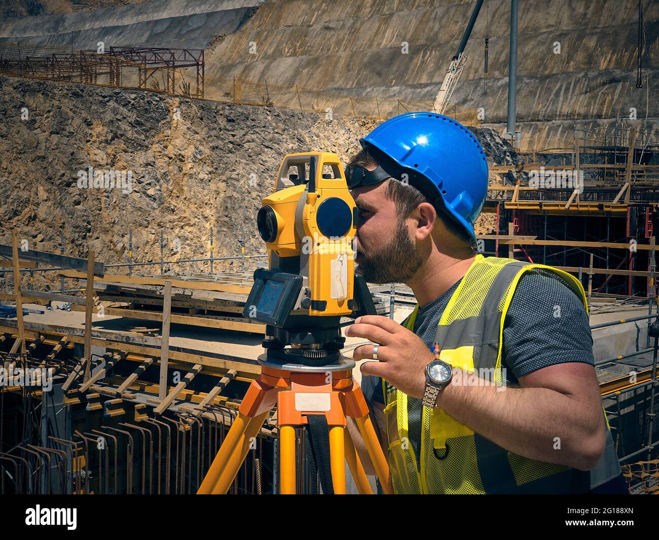 Land surveyor works at construction site Stock Photo - Alamy