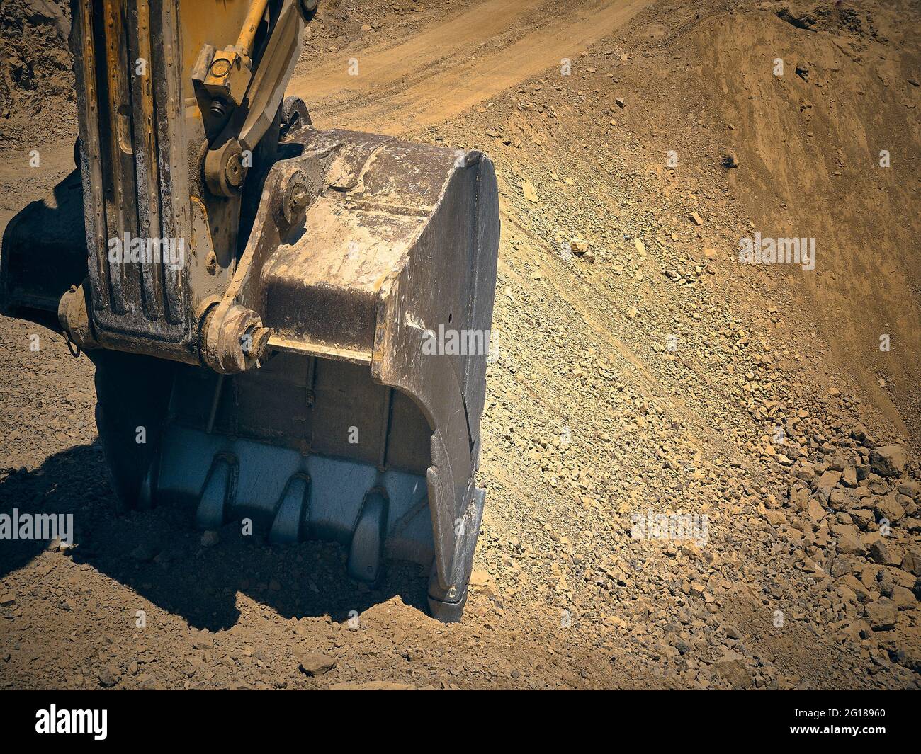 Bucket of excavator on construction site Stock Photo - Alamy