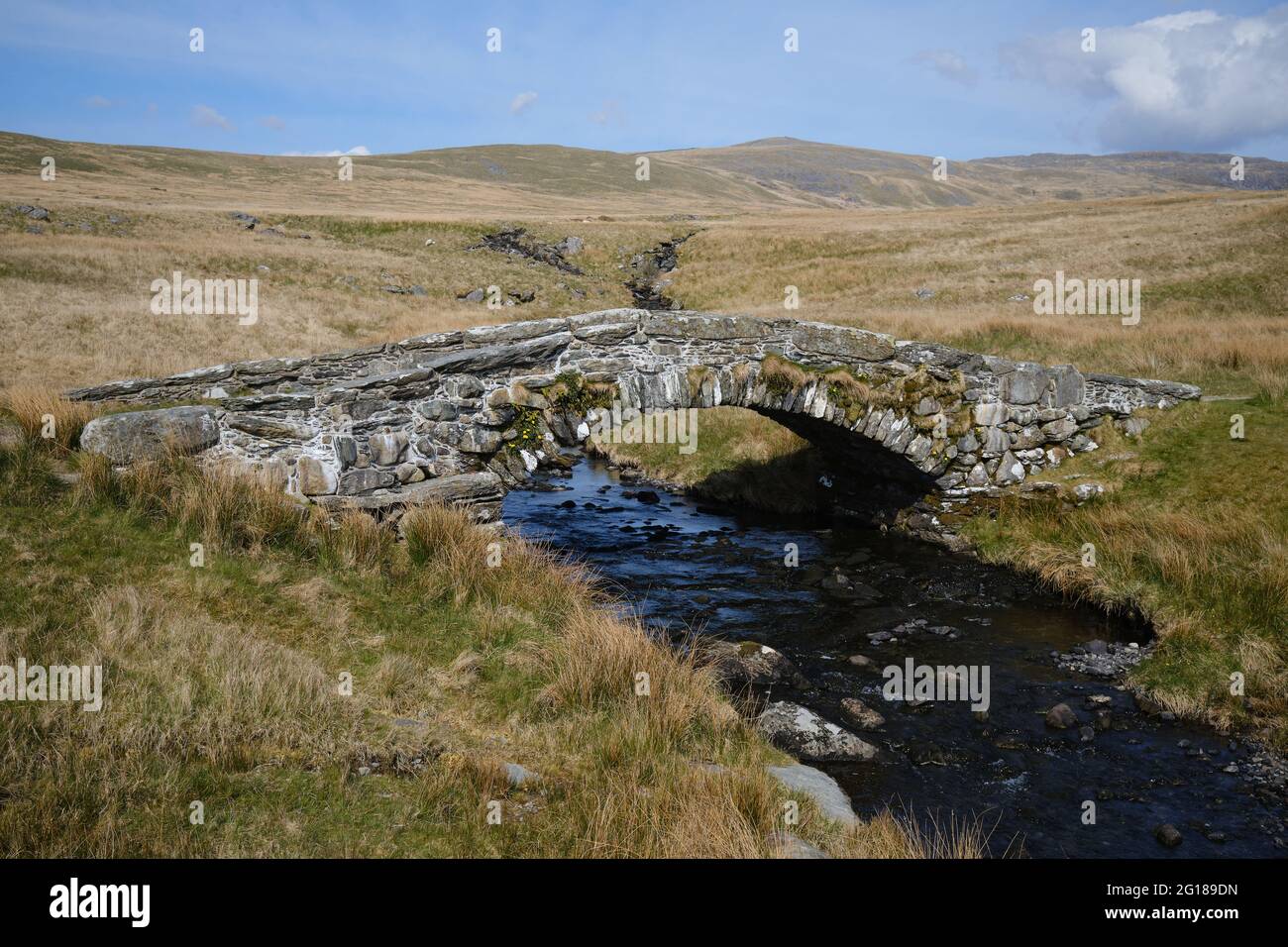arched bridge over a moorland river Stock Photo - Alamy