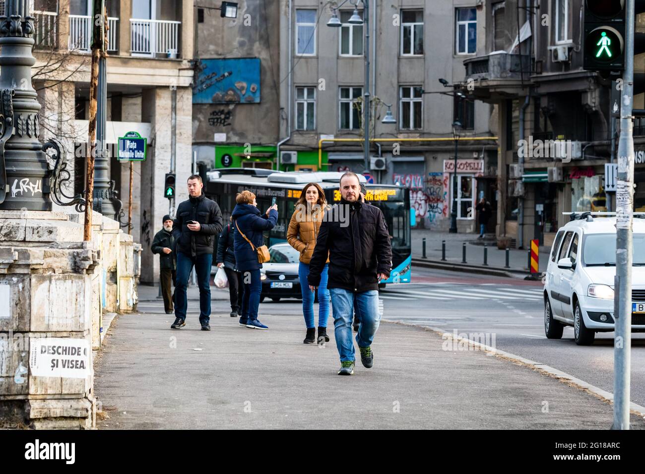 People moving, walking on the streets in downtown of Bucharest, Romania ...