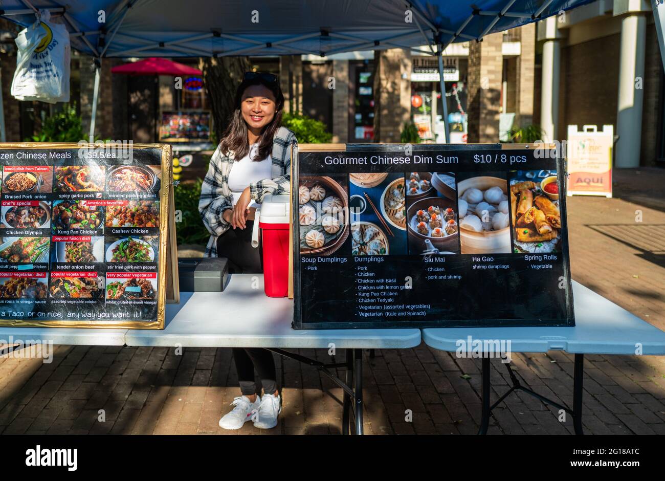 Reston, VA, USA -- June 5, 2021. Photo of a young woman working a ...