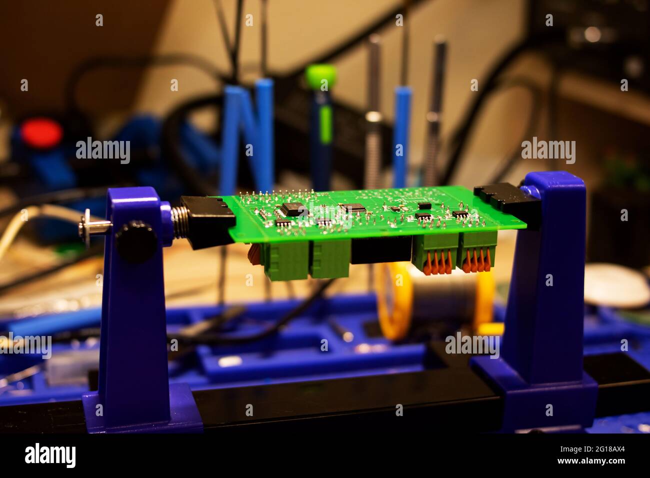 Soldering process on a green PCB close up Stock Photo - Alamy