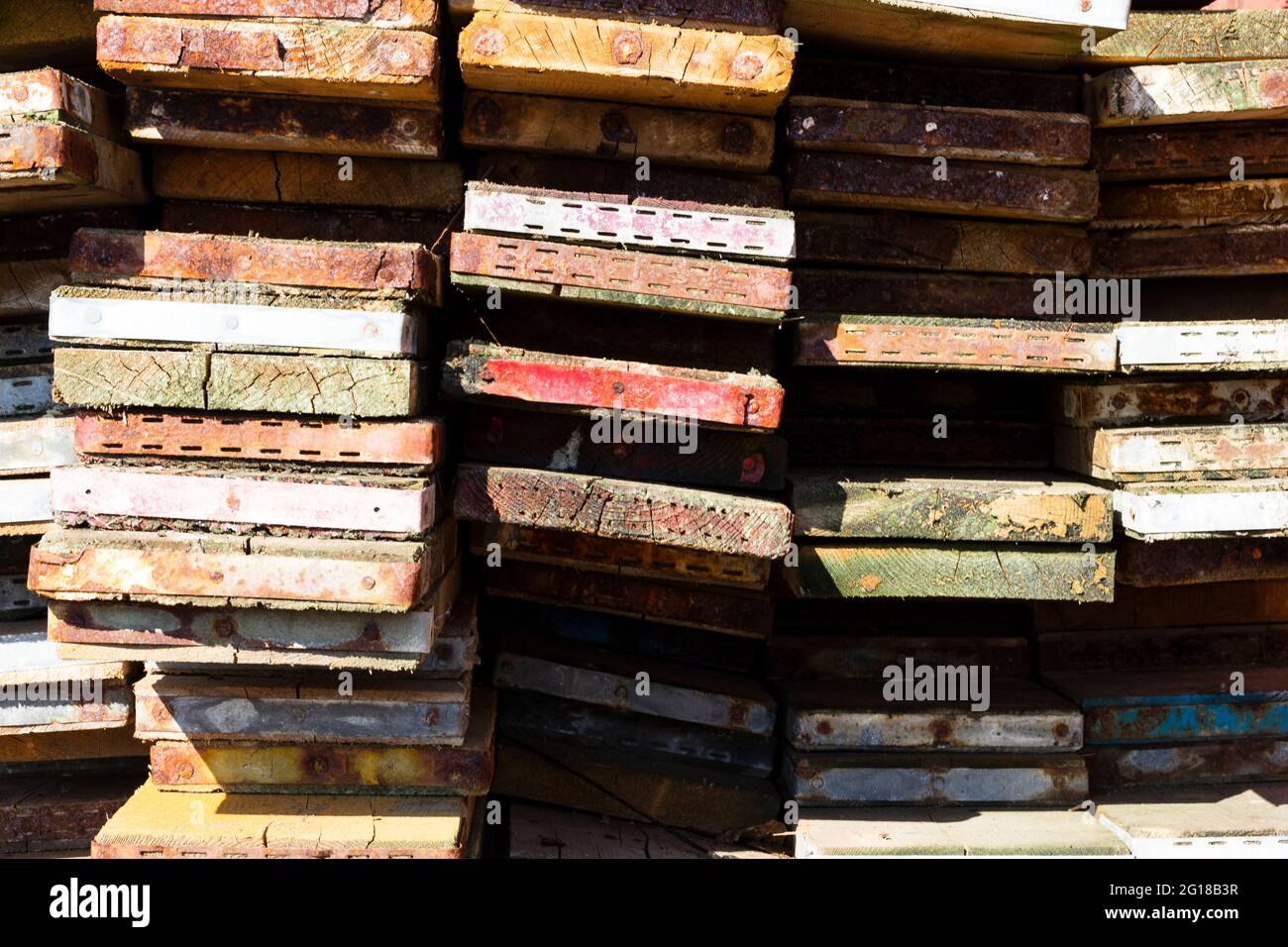 close up on a pile of scaffold boards Stock Photo - Alamy