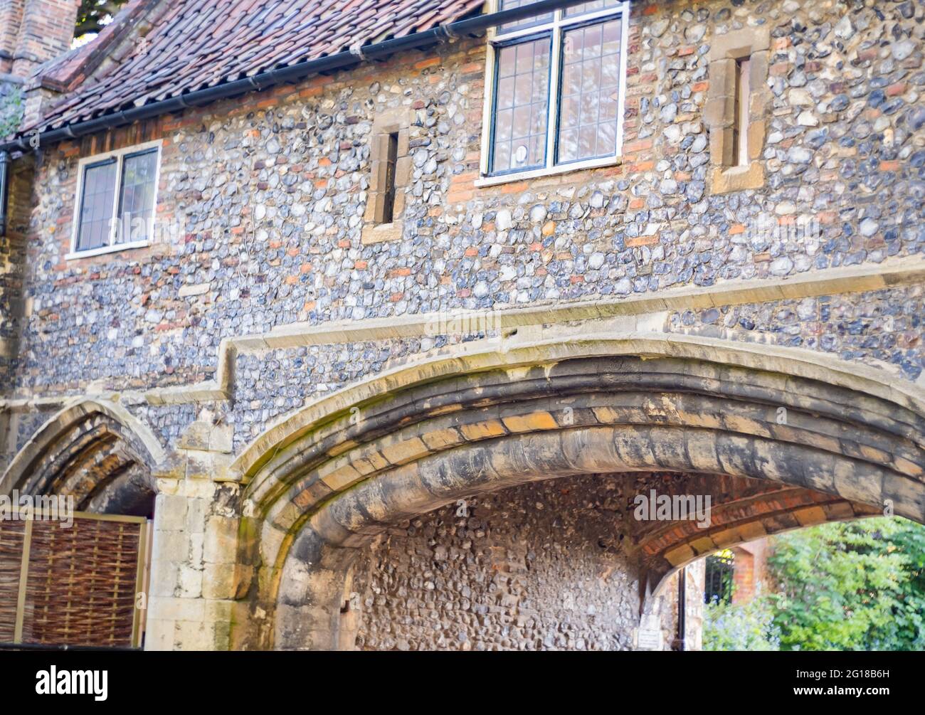 Historic flint built building and arch in the city of Norwich in ...