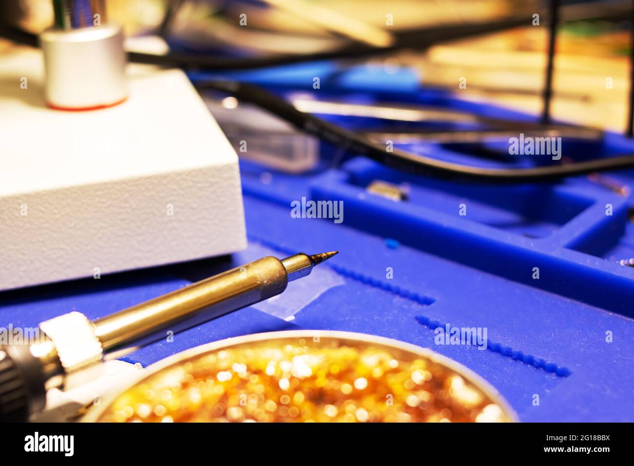 Hot soldering iron and yellow rosin close up Stock Photo - Alamy