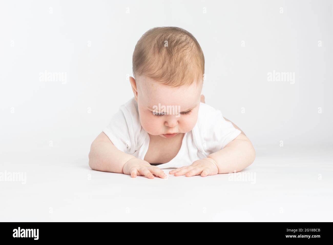Baby looks down hi-res stock photography and images - Alamy