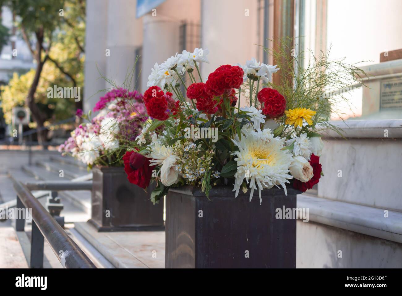 Flower arrangement with red, white and yellow flowers Stock Photo - Alamy
