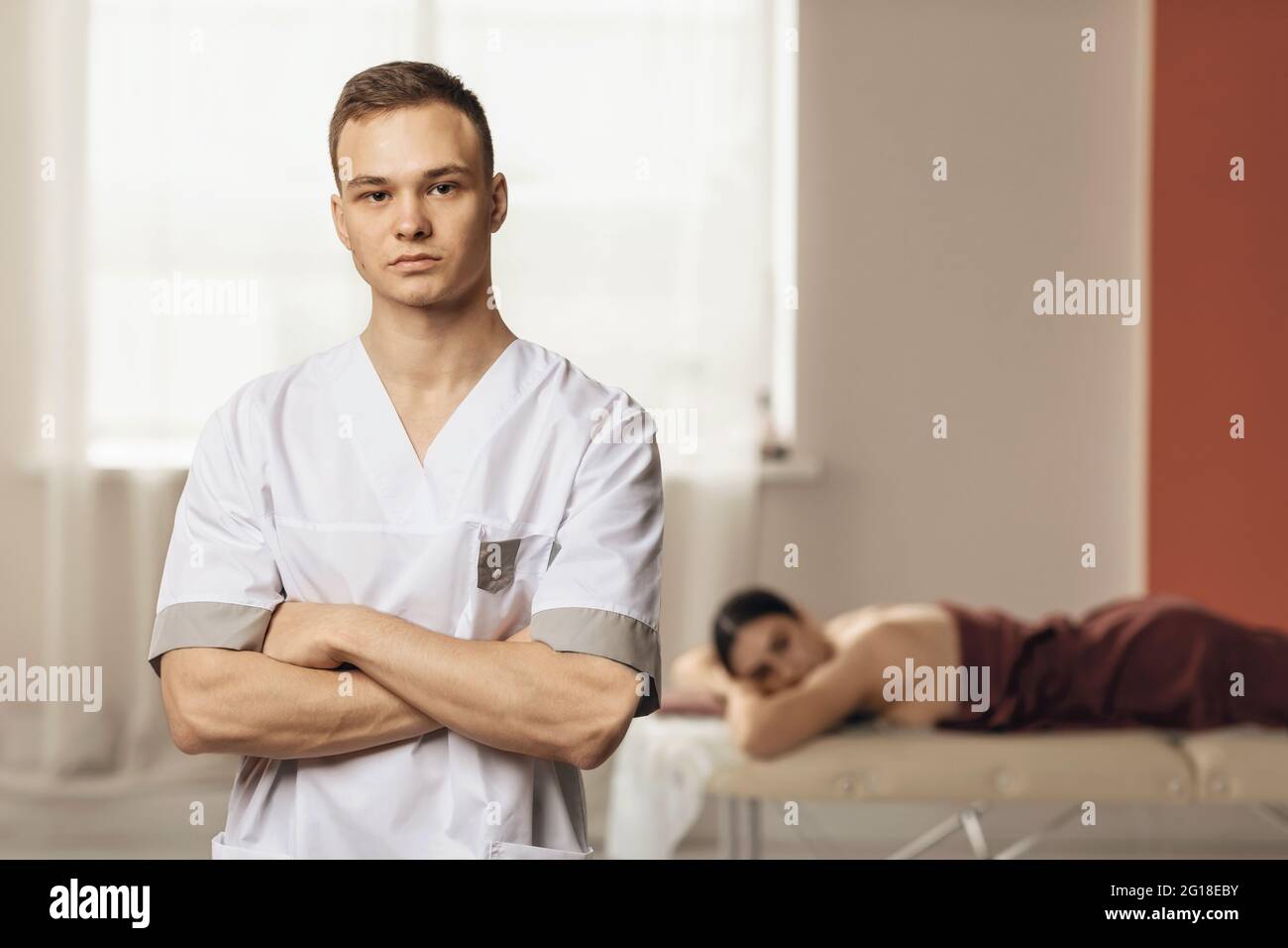 Young masseur hi-res stock photography and images - Alamy