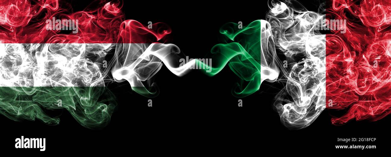 Hungary, Hungarian vs Italy, Italian smoky flags side by side Stock ...