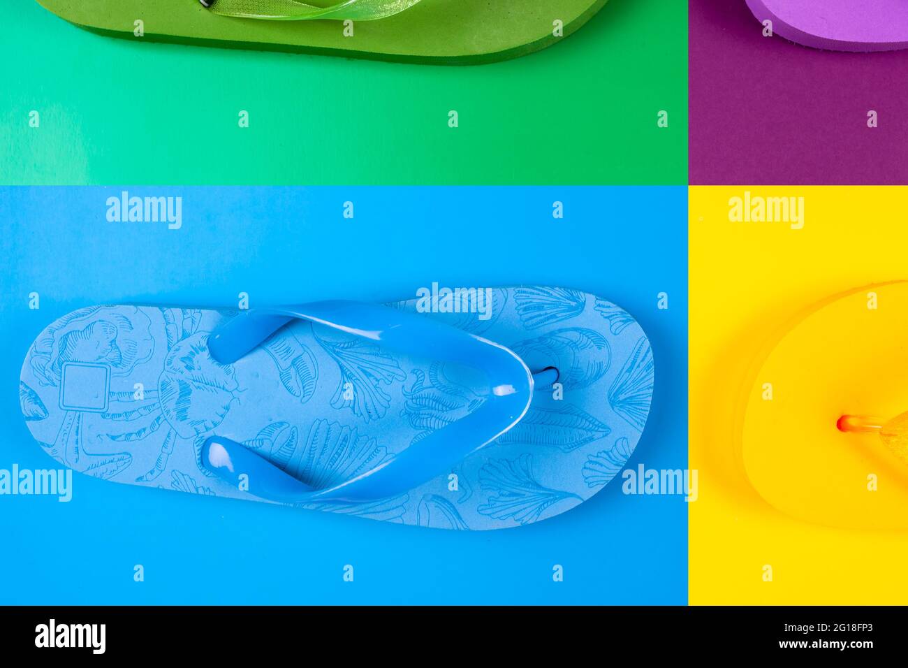 multi-colored rubber flip flops on multicolored backgrounds, view from ...