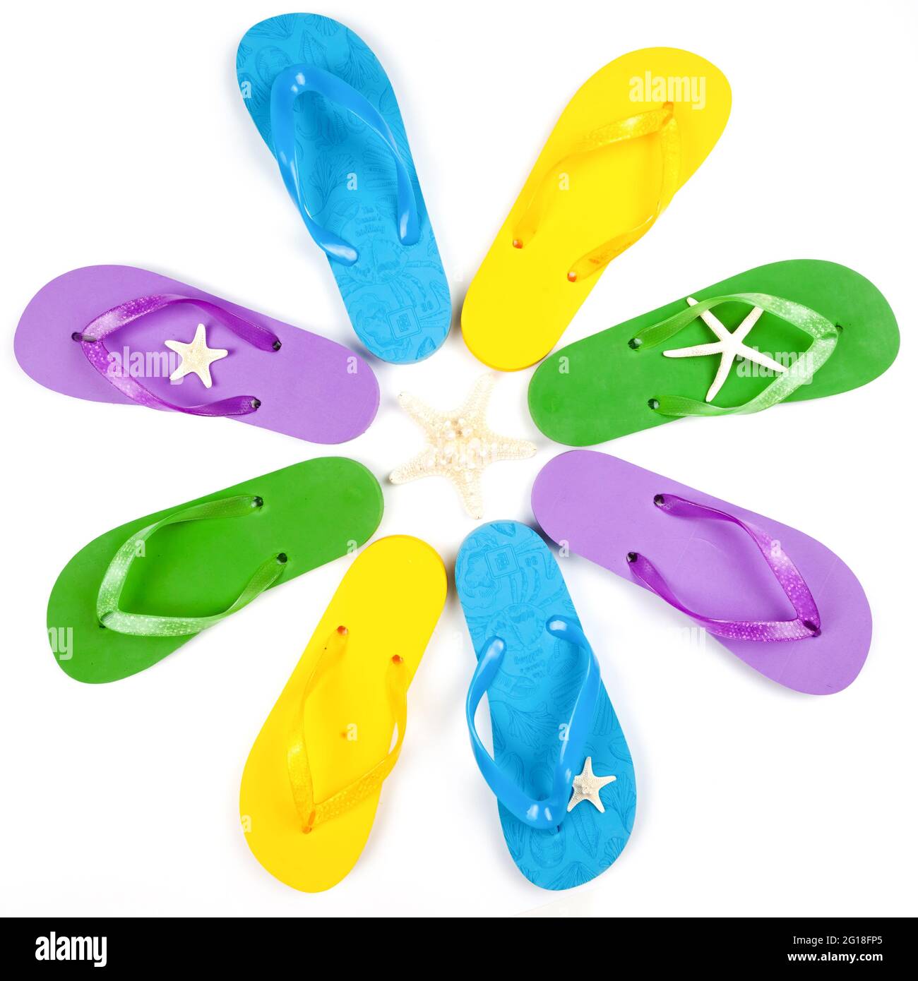 three pairs of beach rubber flip flops on a white background, view from ...