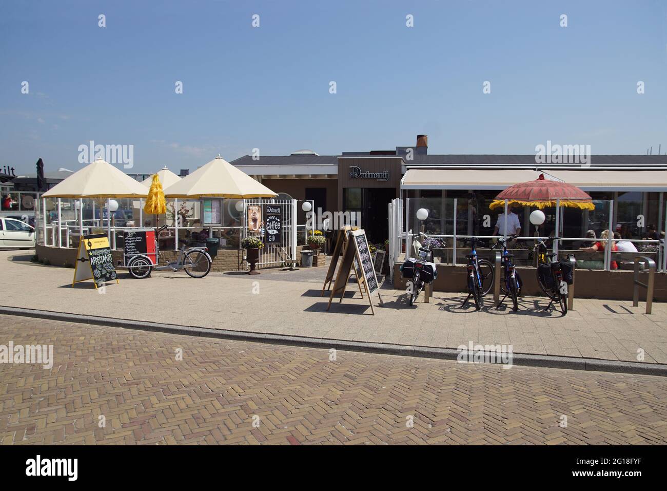 View of the terrace of the Dutch restaurant Duinerij in the village of ...