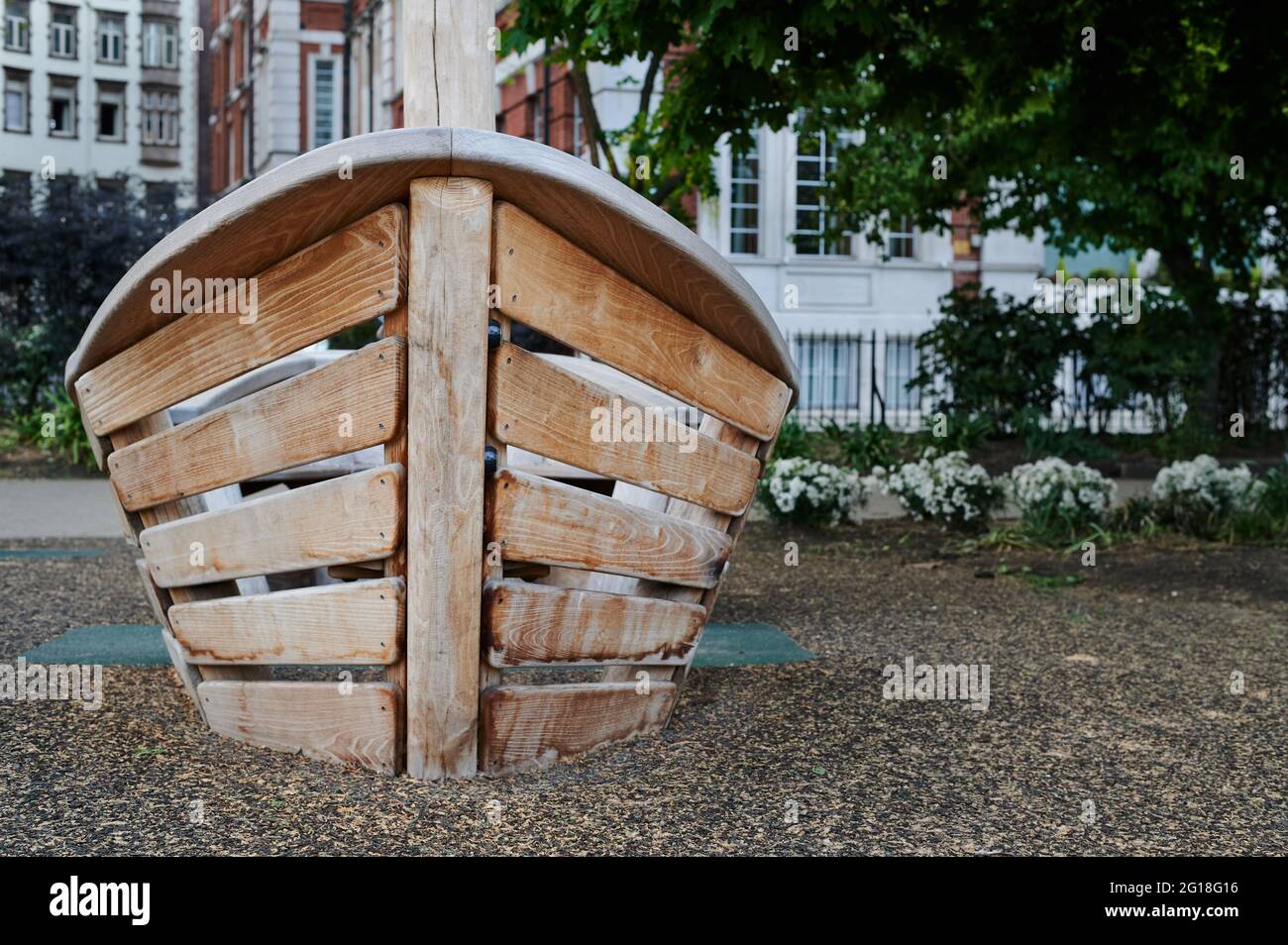 Front view of a small boat shape climbing frame for children in a ...