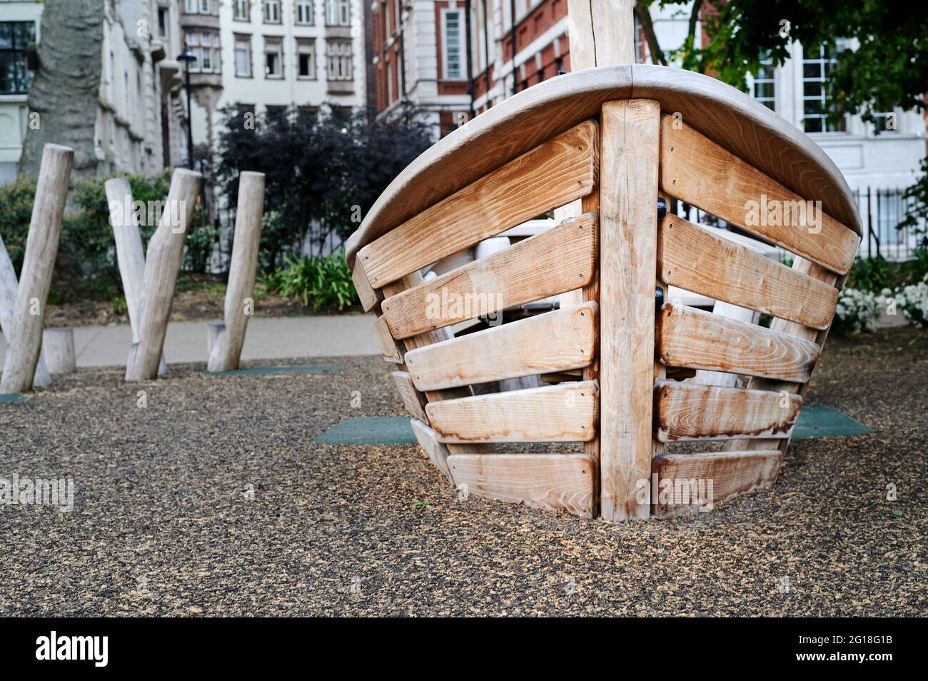 Front view of a small boat shape climbing frame for children in a ...