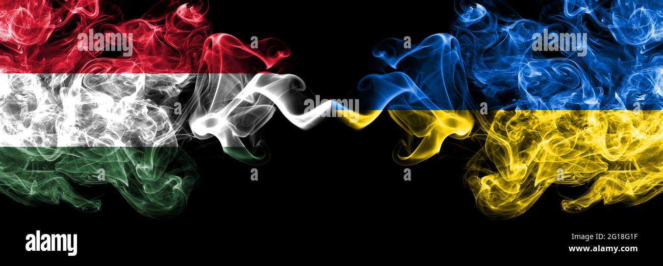 Hungary, Hungarian vs Ukraine, Ukrainian smoky flags side by side Stock ...