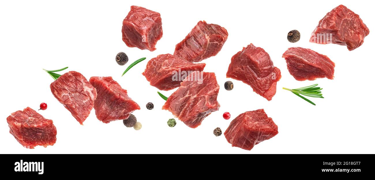 Falling diced beef meet, cubes of raw beef with rosemary isolated on ...