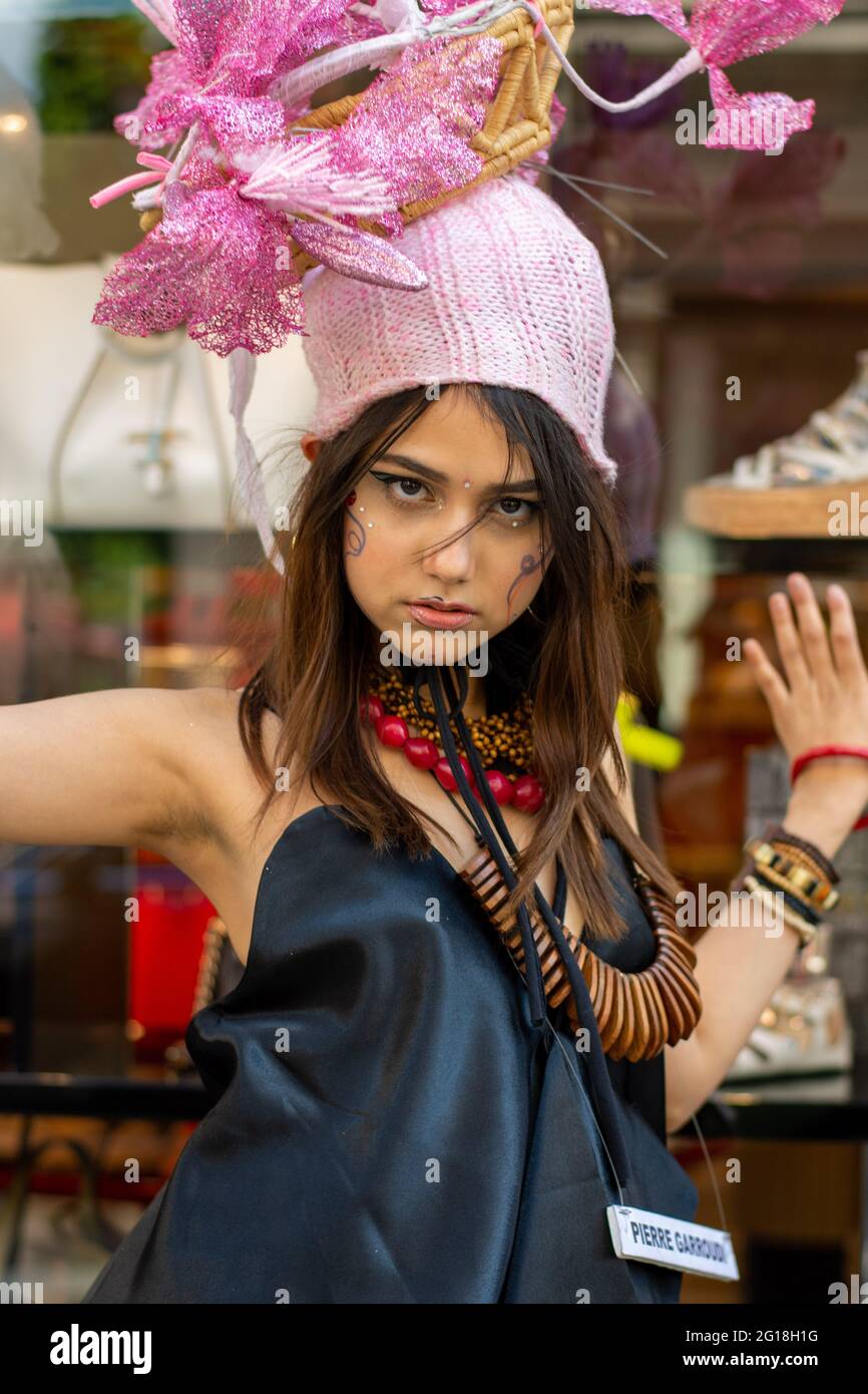 A model showcases Pierre Garroudi's latest colourful collection at one ...
